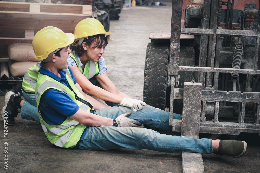 Accident at workplace, industrial engineer worker wearing helmet hit by ...