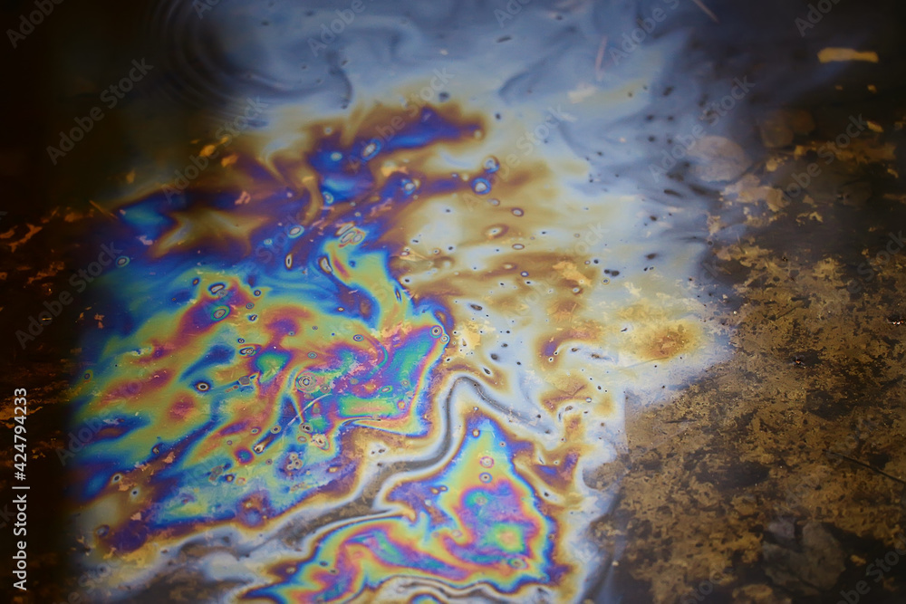 oil spills on puddle background, abstract gasoline nature pollution ...