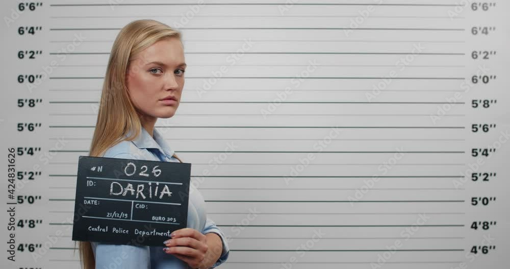 Side profile mugshot of millennial woman turning head and looking to ...
