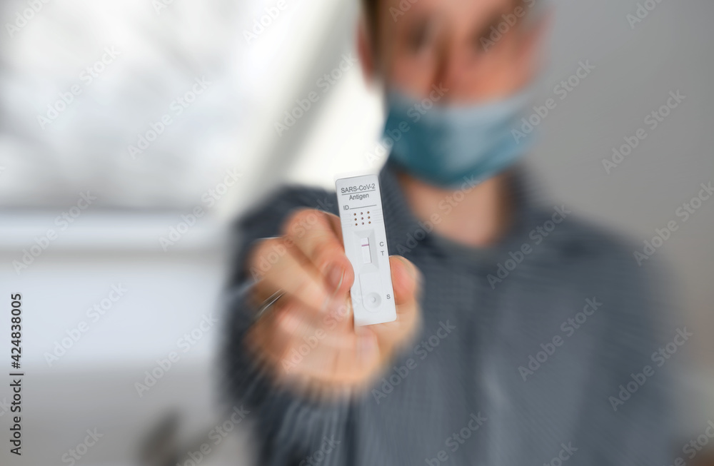 man does rapid self test for COVID-19 home test kit. Coronavirus nasal ...