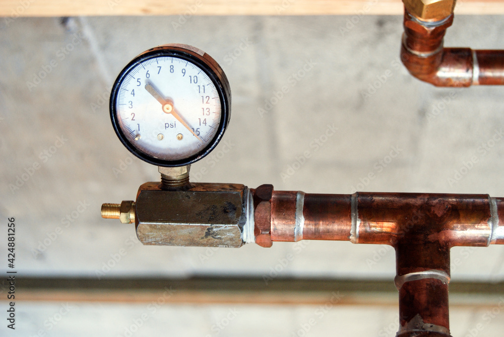 Pressure gauge on copper water pipe close-up Stock Photo | Adobe Stock