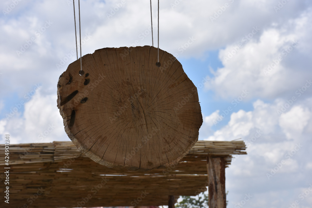 a tree stump hung up to make a billboard. a tree stump used as a ...