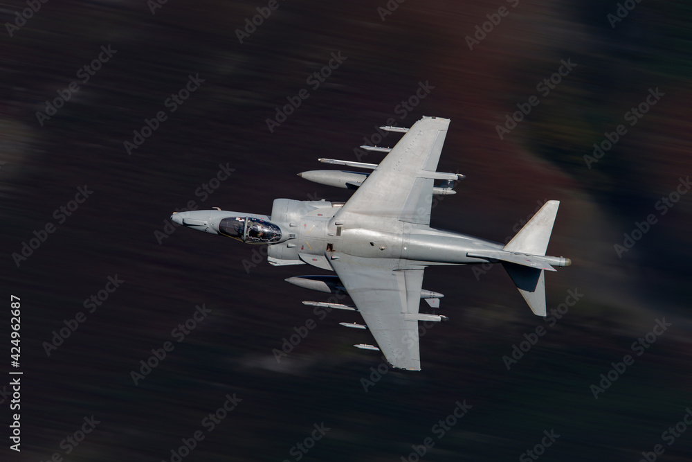 Harrier jump jet strike fighter flying low level showing top side of ...