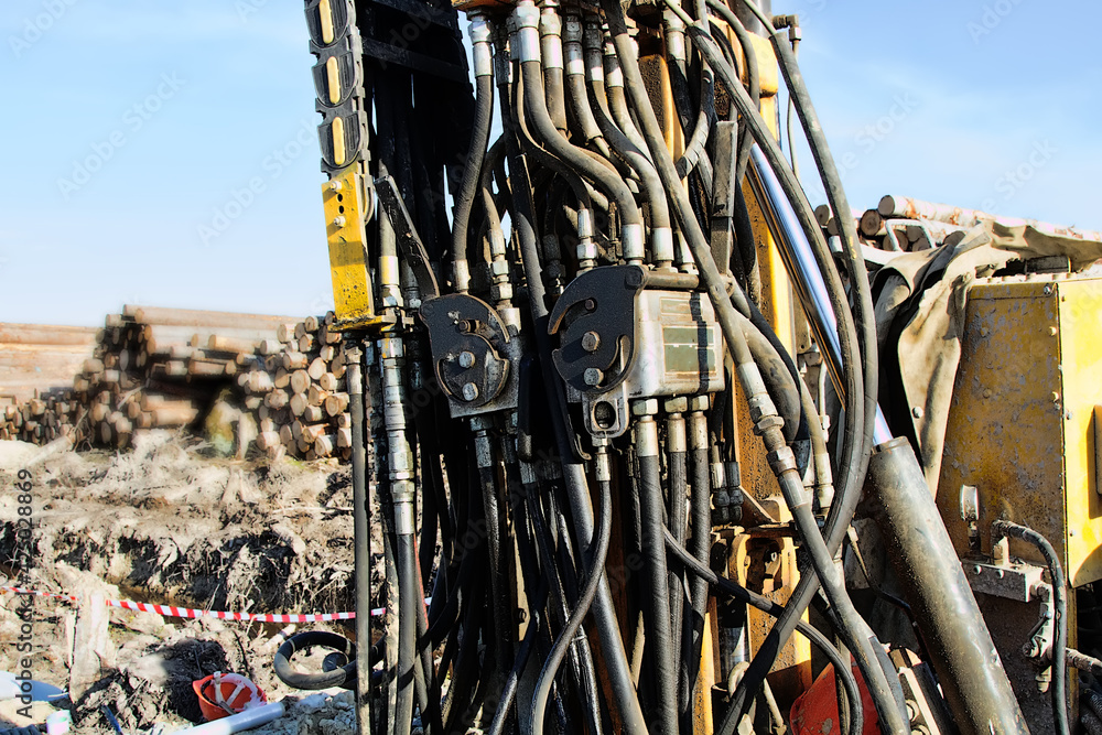 Mini-drilling rig on crawler track on site of sawn forest where large ...
