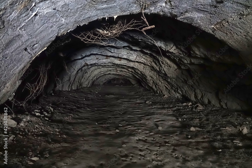 Mudslide destroyed tunnel and road. Natural disaster in mountains in ...