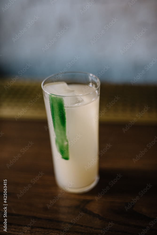 Highball gin cocktail with lychee, sparkling ginger water. Glass ...