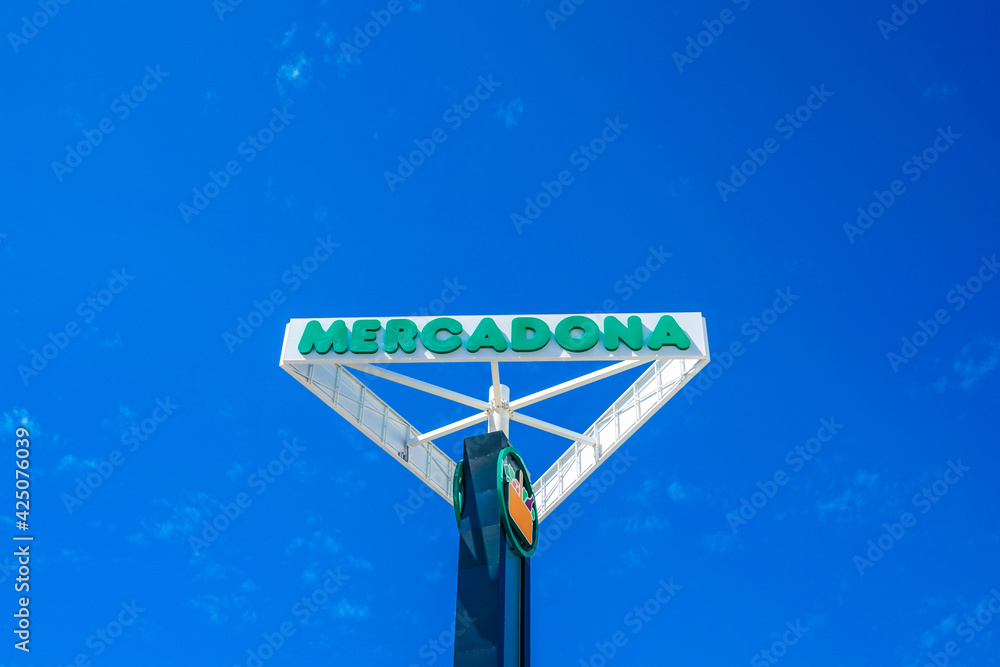 Mercadona signboard and logo over blue sky. Mercadona - popular Spanish ...