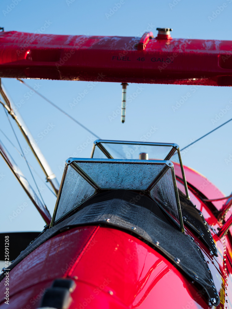 Red biplane with an open cockpit in tandem arrangement Stock Photo ...