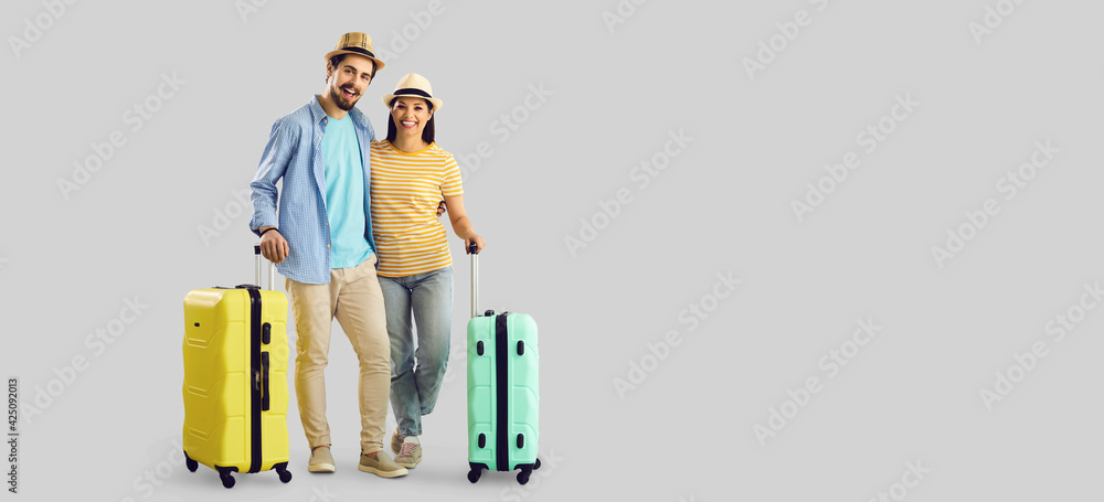 Happy smiling couple tourist traveler with luggage suitcase travel bag ...