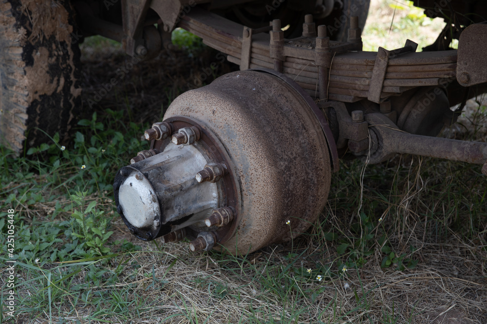 Maintenance a truck wheels hub and bearing. Dirty heavy truck drum ...
