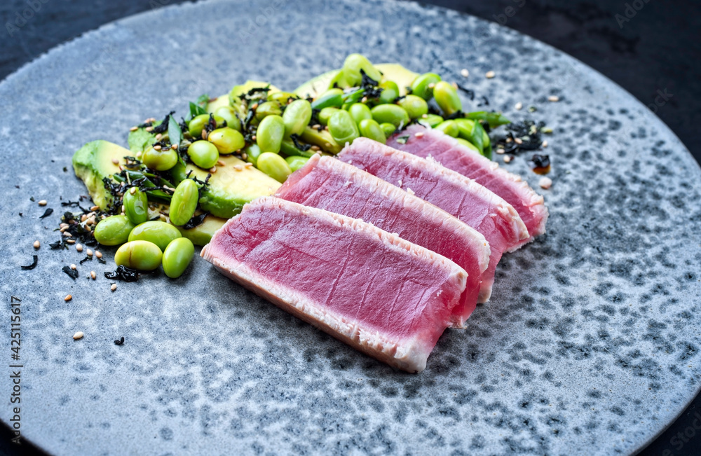 Modern style traditional Japanese gourmet seared tuna fish steak tataki ...