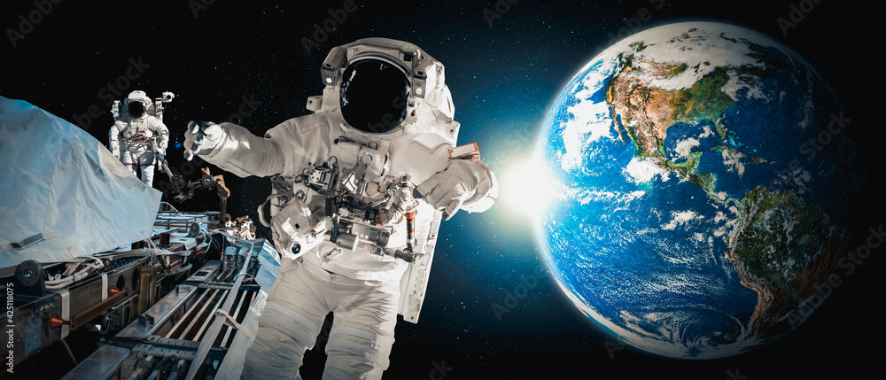 Astronaut spaceman do spacewalk while working for space station in ...