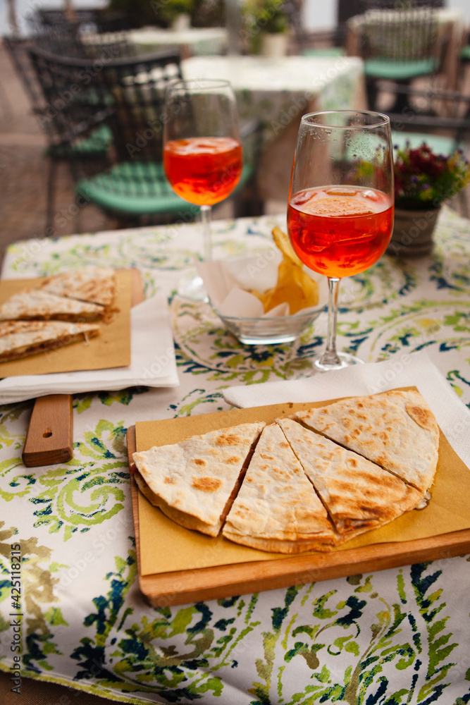 Italian traditional street food and aperitif. Aperol spritz with ...