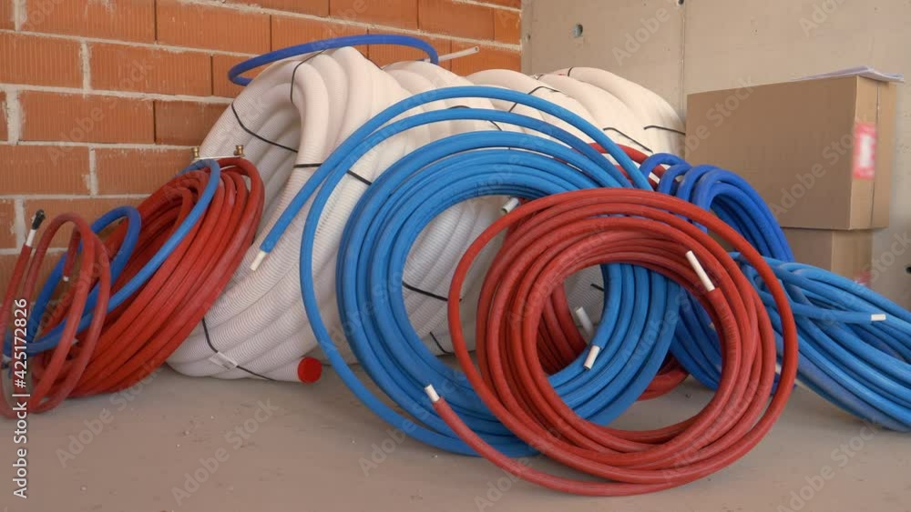 CLOSE UP: Coils of plumbing and recuperation tubing lies in the corner ...