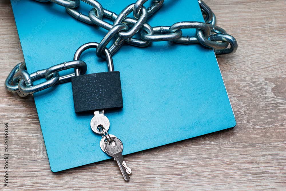 notebook for writing wrapped with an iron chain closed with a lock with ...