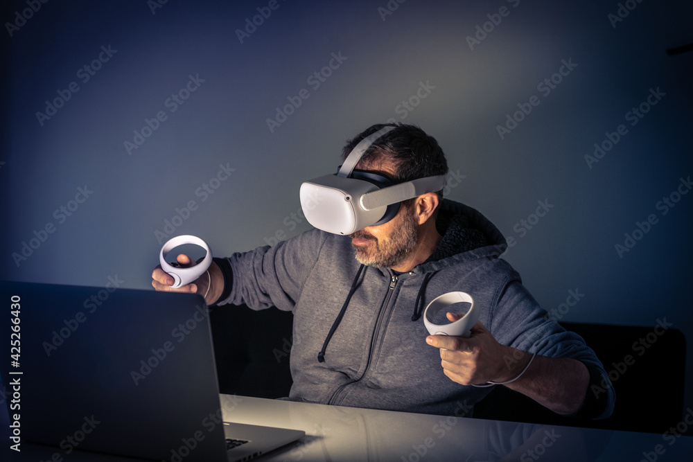 Man playing with virtual reality device. Cyberpunk futuristic mood ...