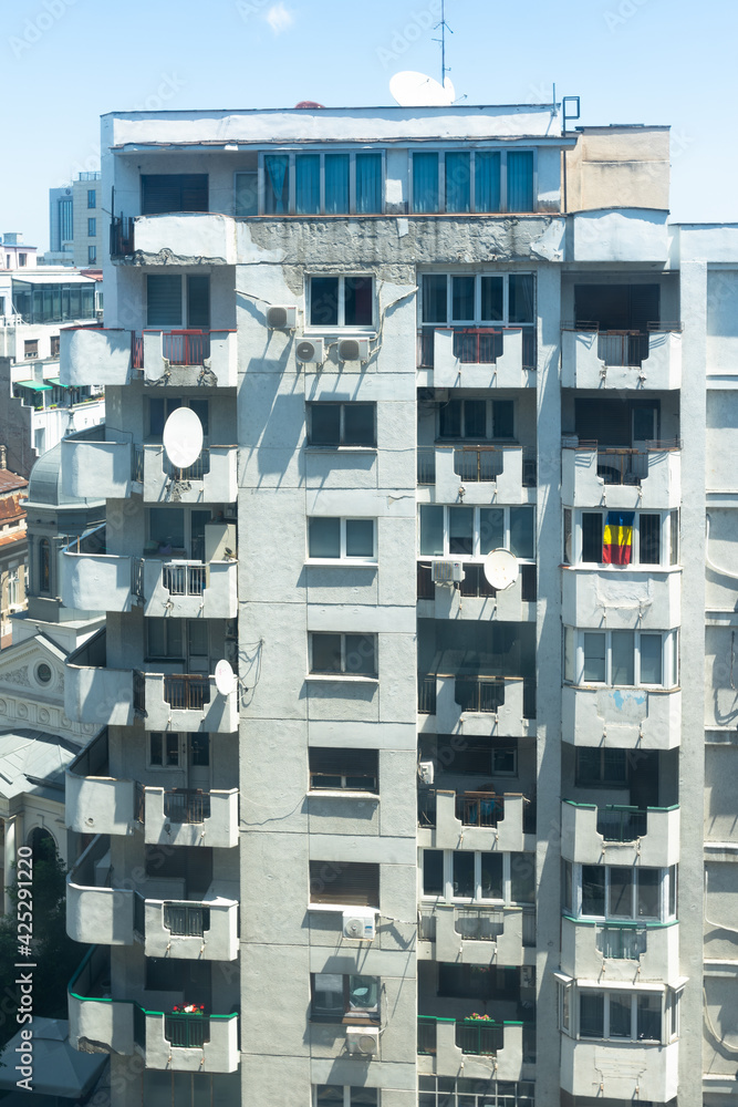 Socialist modernism residential building facade in downtown Bucharest ...