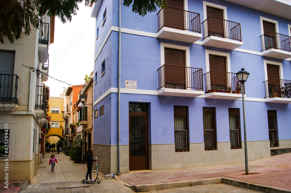Facade of houses of different living colors typical in Spain. Stock ...