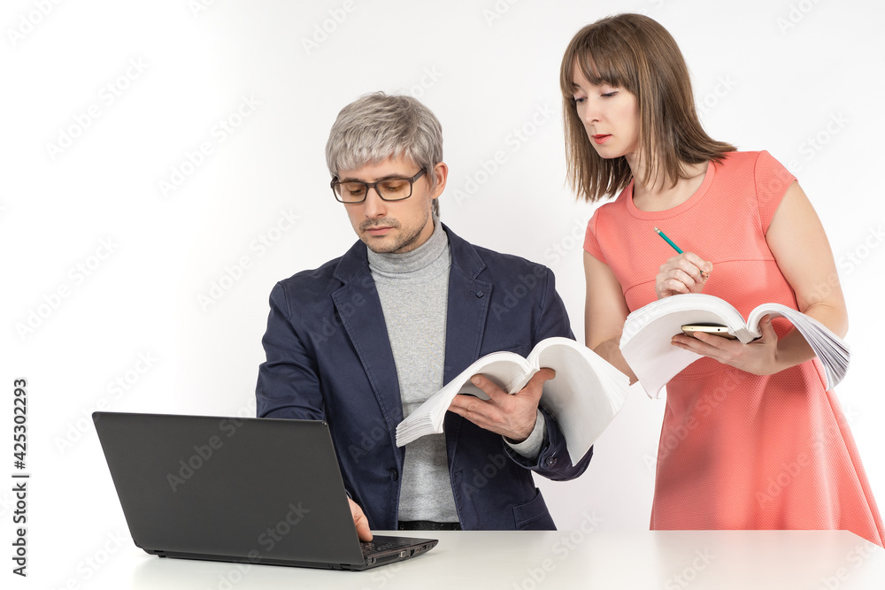 Businessman next to assistant. Concept - girl works as an assistant to ...