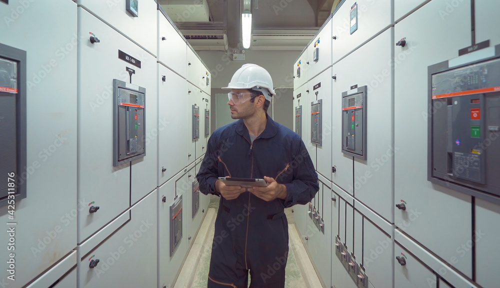 An engineer man or worker, people working in electrical room. Power ...