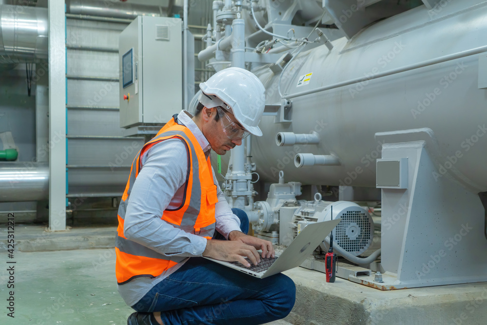An engineer man or worker, people using a laptop computer, working in ...