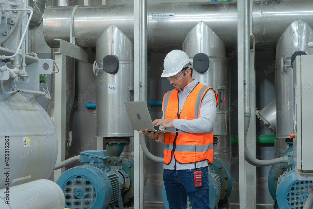 An engineer man or worker, people using a laptop computer, working in ...