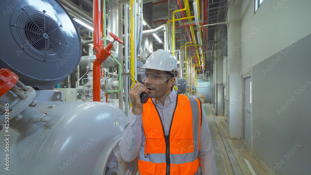 An engineer man or worker, people working in industry factory. Chiller ...