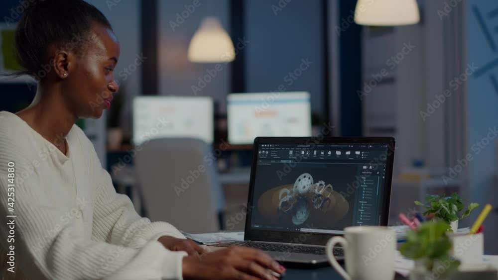 Excited black woman industry architect working on modern cad program ...