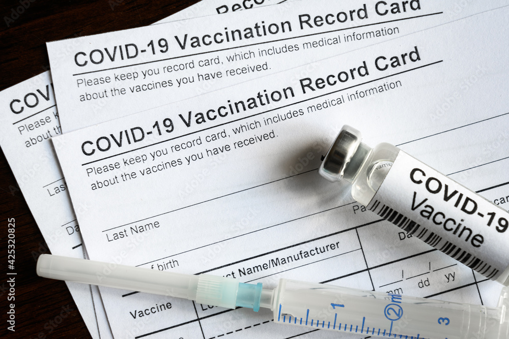 COVID-19 Vaccination Record Card on desk, coronavirus immunization ...