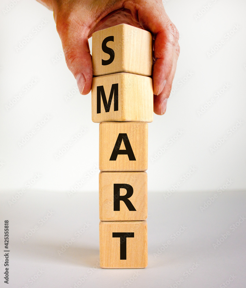 Smart art symbol. Businessman turns cubes and changes the word 'smart ...