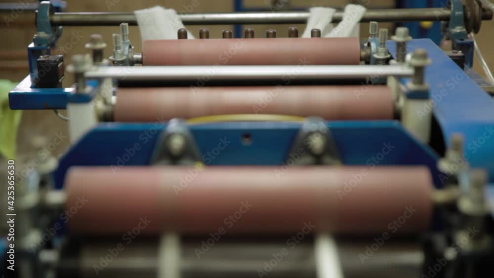 Zoomed in video shot inside a factory, showing the industrial process ...