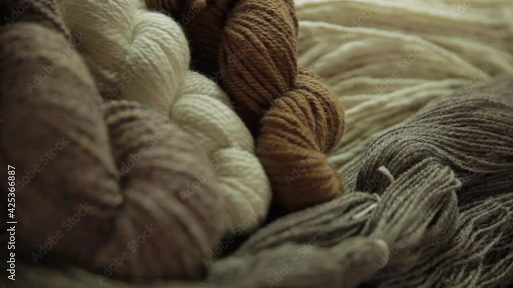Zoomed in video showing fruitful results of wool making process, dyed ...