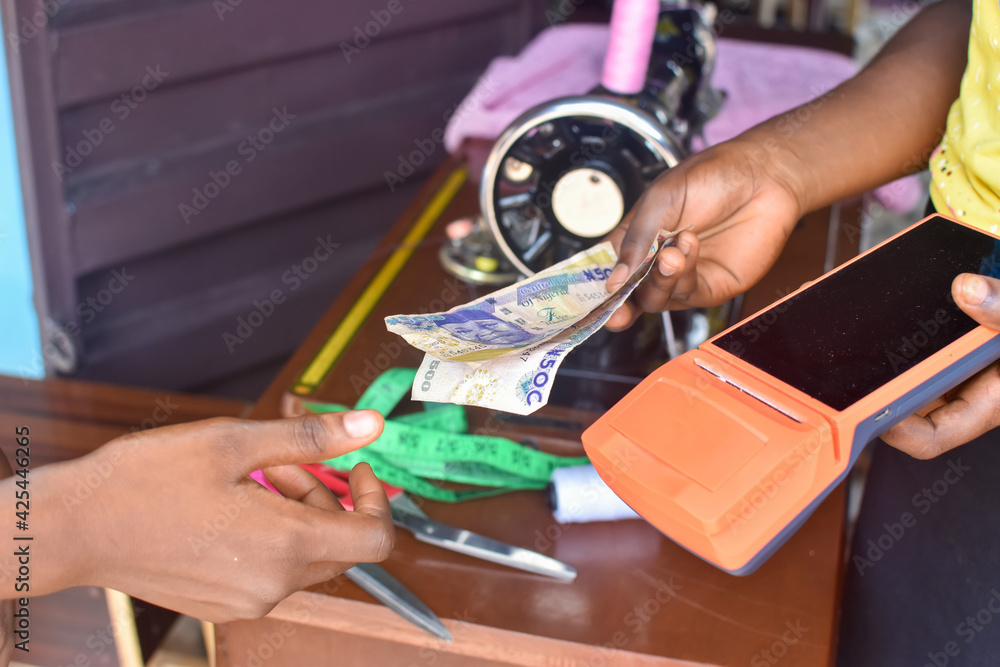 Foto de Point of sales known as POS terminal device used for cash naira ...