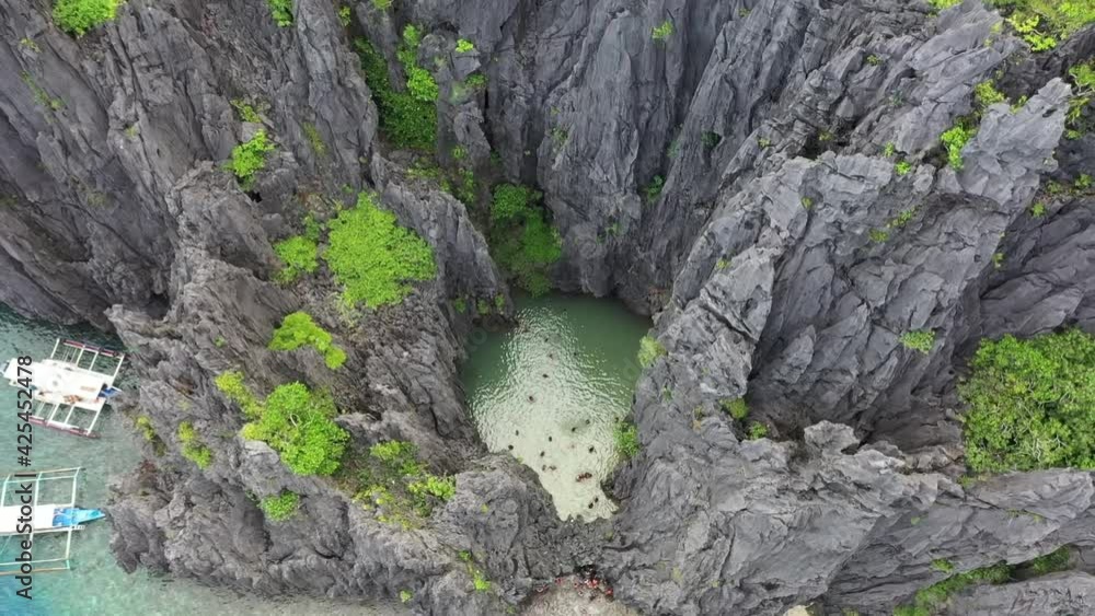 Aerial of beautiful karst scenery and turquoise ocean water around El ...