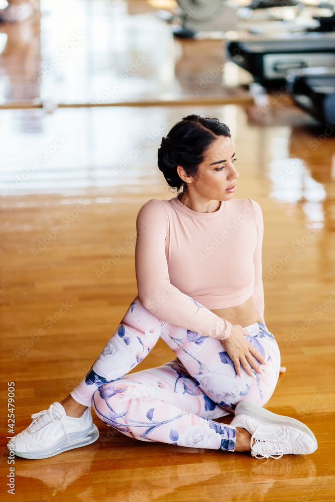 attractive athletic woman stretching workout in gym. fitness woman ...