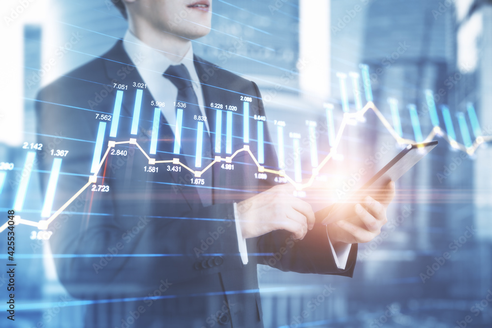 Entrepreneur counting the trading bar charts on the background with ...