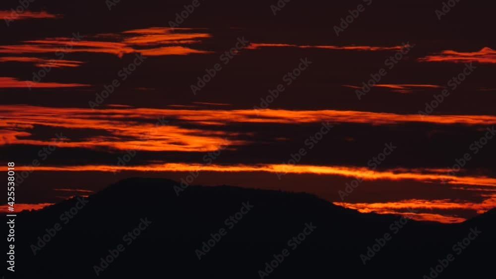 Cinematic sunset time lapse shot, large sun disc move down, hide at ...