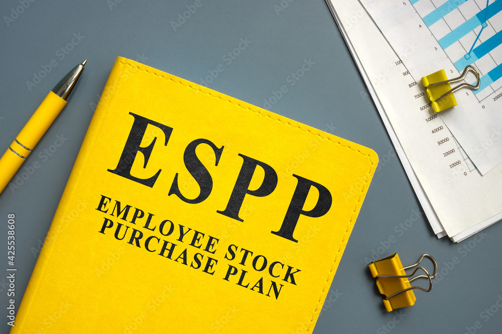 Employee Stock Purchase Plan ESPP and papers with charts and pen. Stock ...