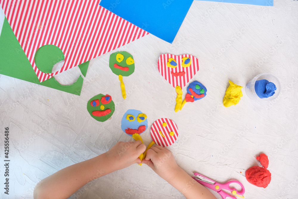 Child modeling fun craft . Modeling clay and paper crafts idea for kids ...