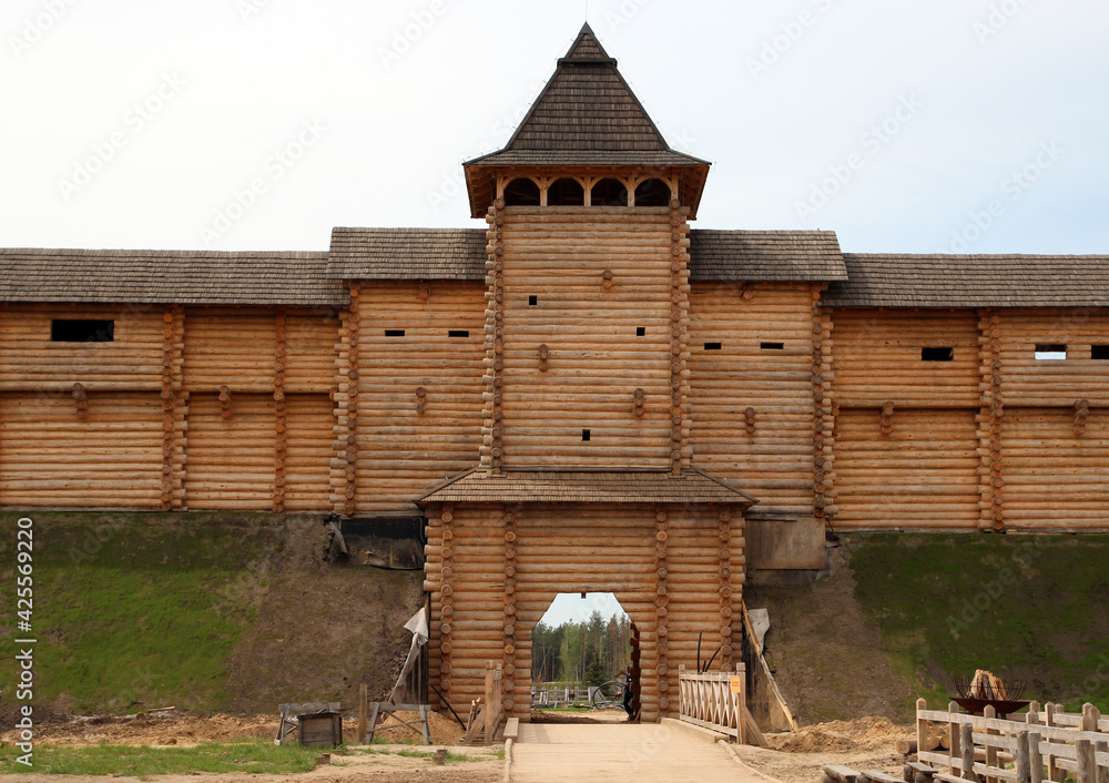 Ancient wooden gate and walls of the medieval fort in park Kyivan Rus ...