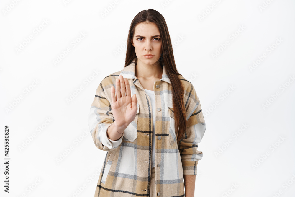 Stay away, I said no. Confident woman stretch hand in taboo block ...
