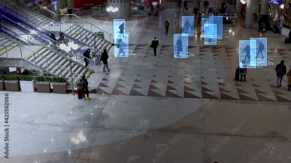 Scanning the crowd of people walking at the railway station ...