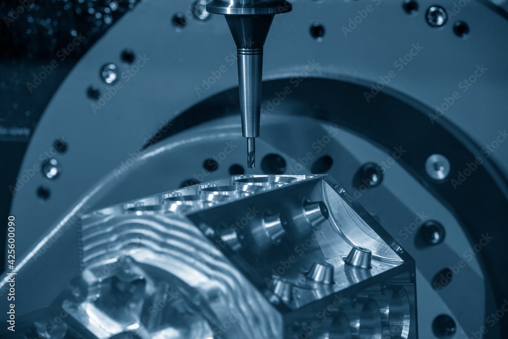 The 5-axis machining center cutting the v8-engine cylinder block. The 5 ...