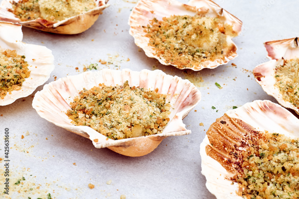 Backed scallops in shells on white background. Scallops au gratin on ...