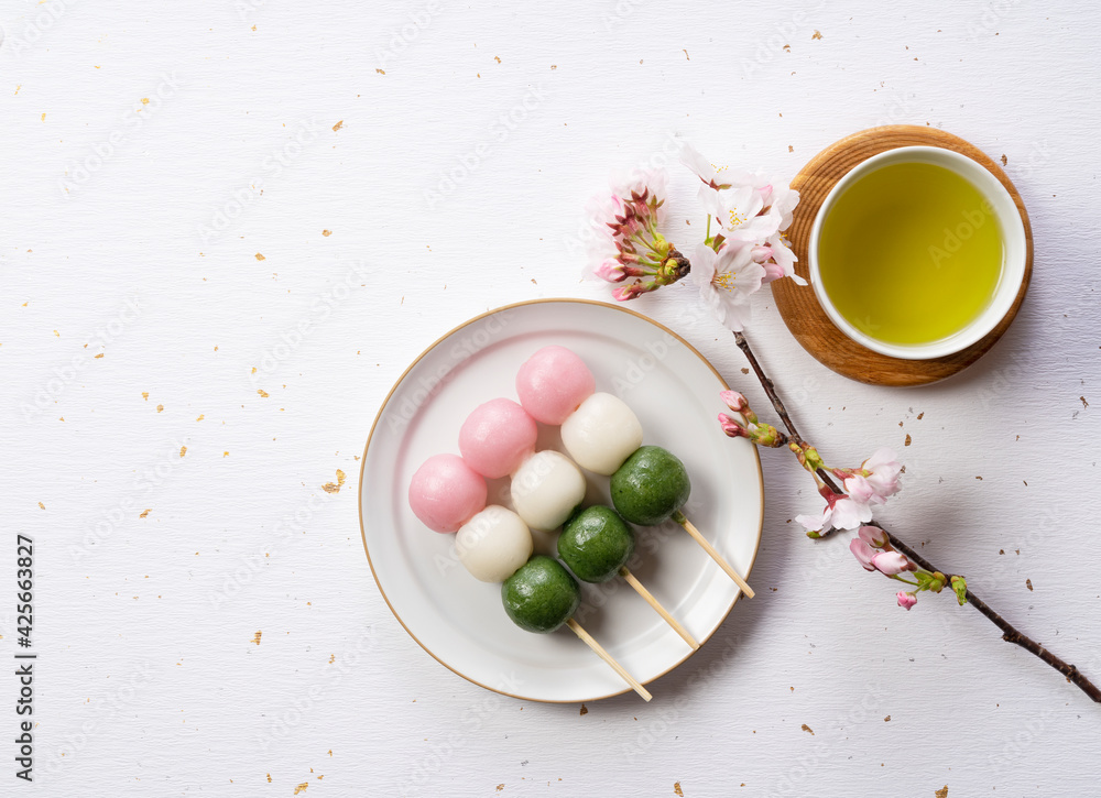 Sanshoku dango and green tea. An image of Japanese spring Stock Photo ...