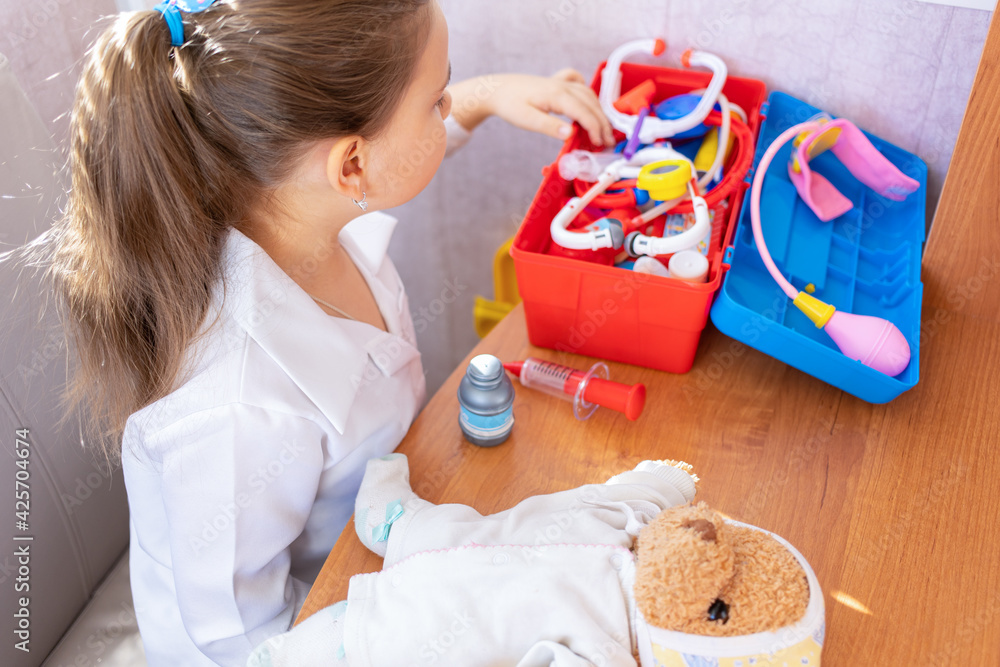 Pretty cute preschool child girl wearing in white medical uniform ...