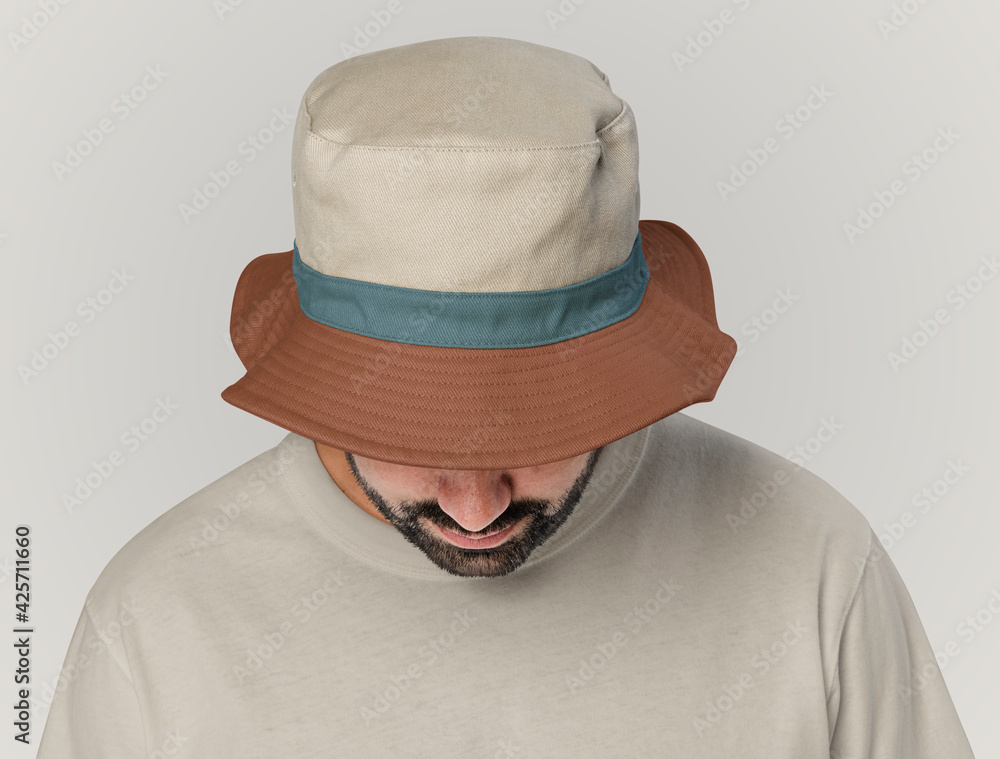 Man wearing bucket hat with minimal design Stock Photo | Adobe Stock