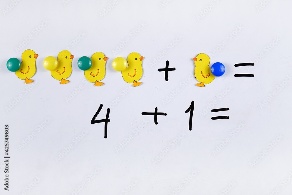 Teaching children the basics of addition of mathematics using magnets ...