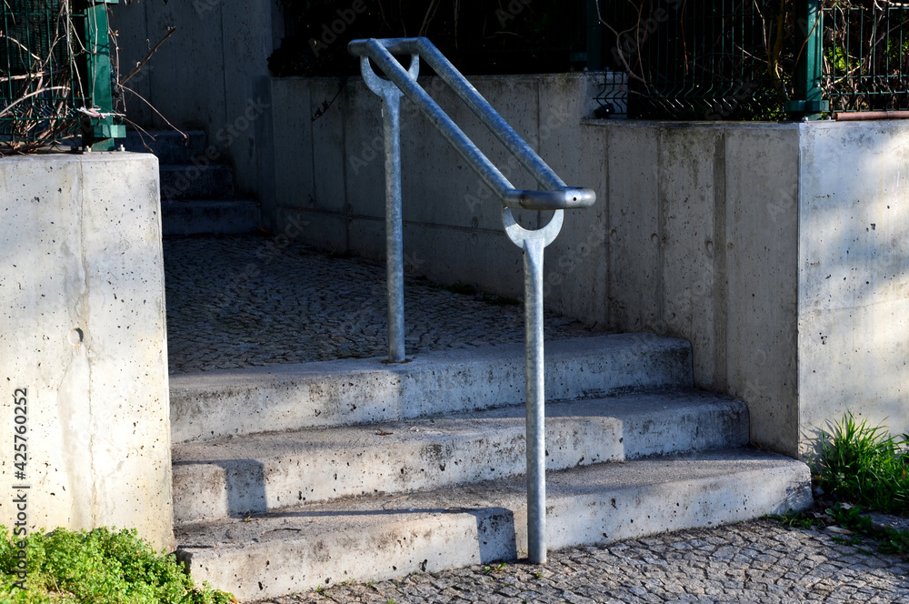 concrete long staircase with long and short pieces of stairs and ramps ...