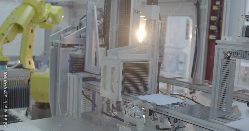Solar panel production, clean energy, green energy. Machines in a ...